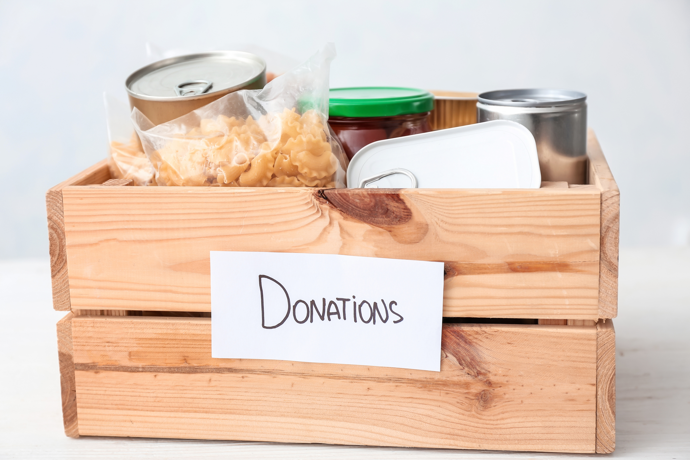 Box with donations on table against light background | RSU 68
